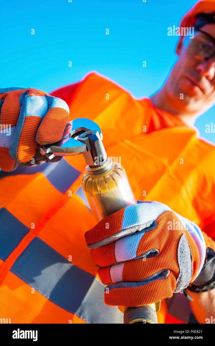 Plumber Worker with Wrench Fixing Some Elements of Plumbing System ...