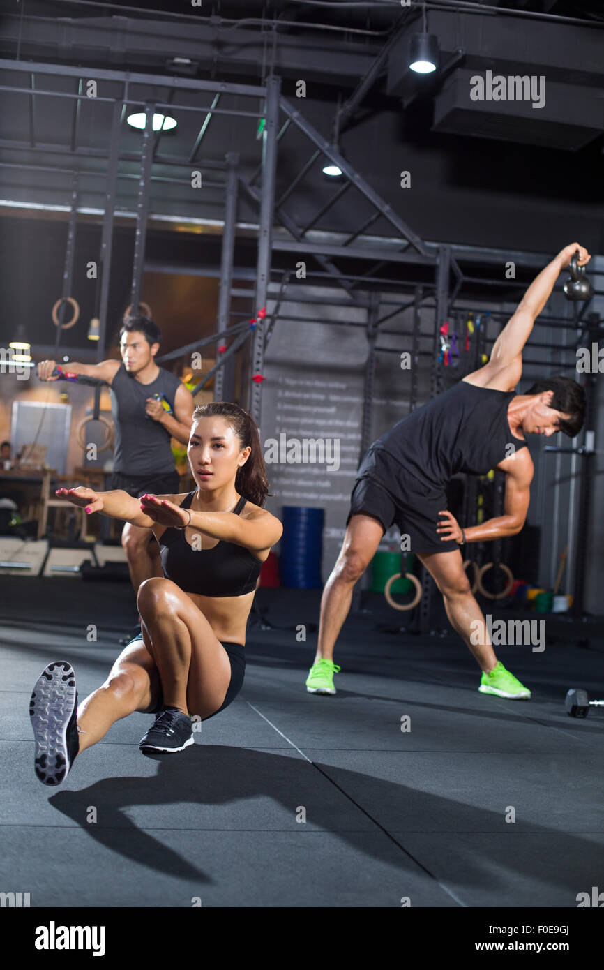 Young athletes exercising at gym Stock Photo - Alamy