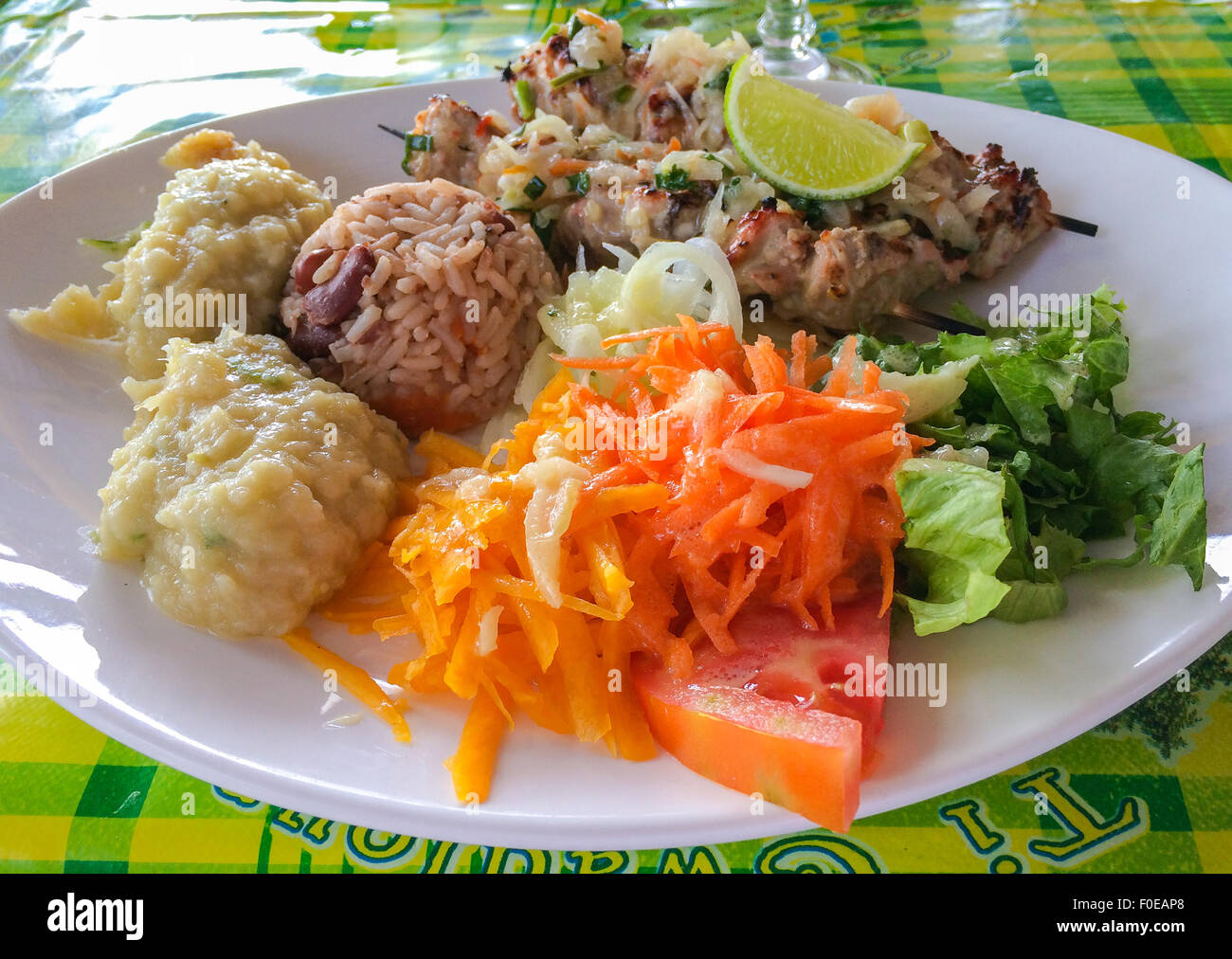 Traditional dish of Guadelope, brochette of sword fish with legumes ...