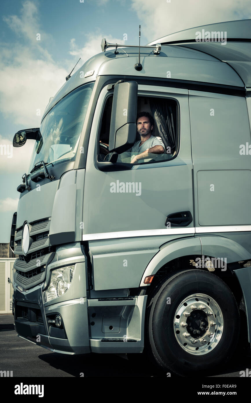 Truck driver with tractor trailer truck Stock Photo - Alamy
