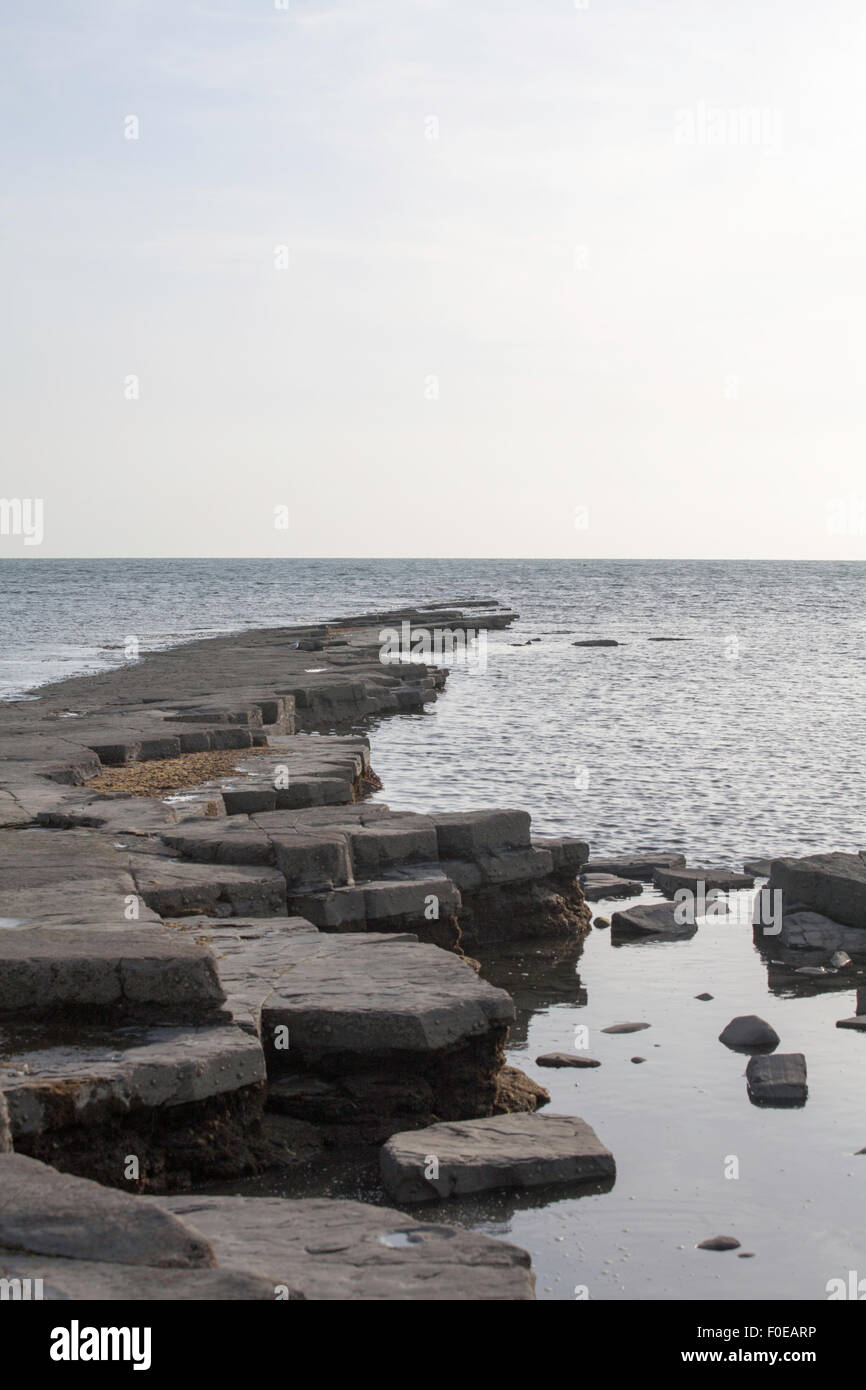 Kimmeridge Bay with it's oil shale rock ledges part of The Jurassic ...