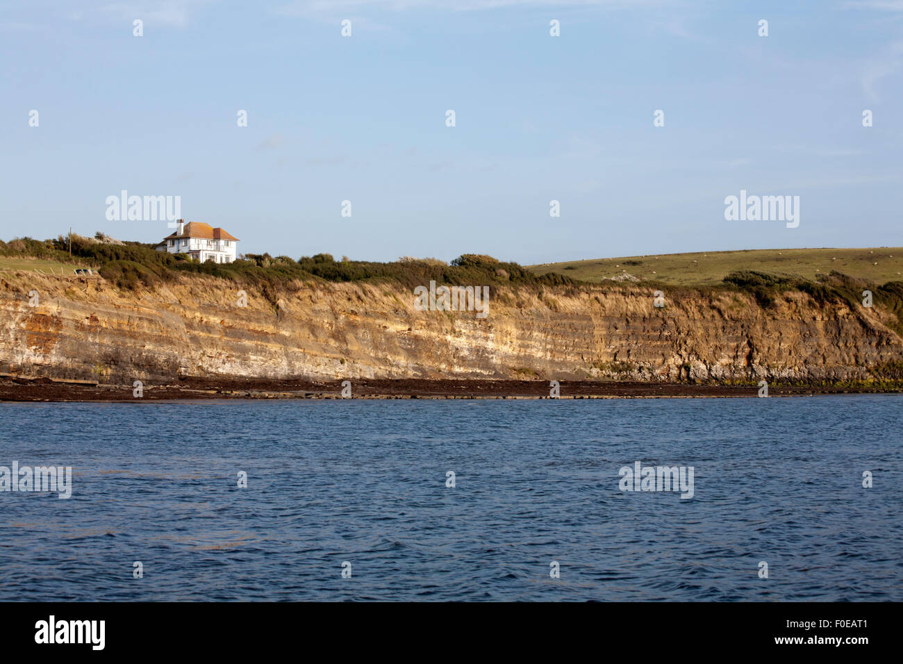 Kimmeridge Bay with it's oil shale cliffs part of The Jurassic Coast of ...