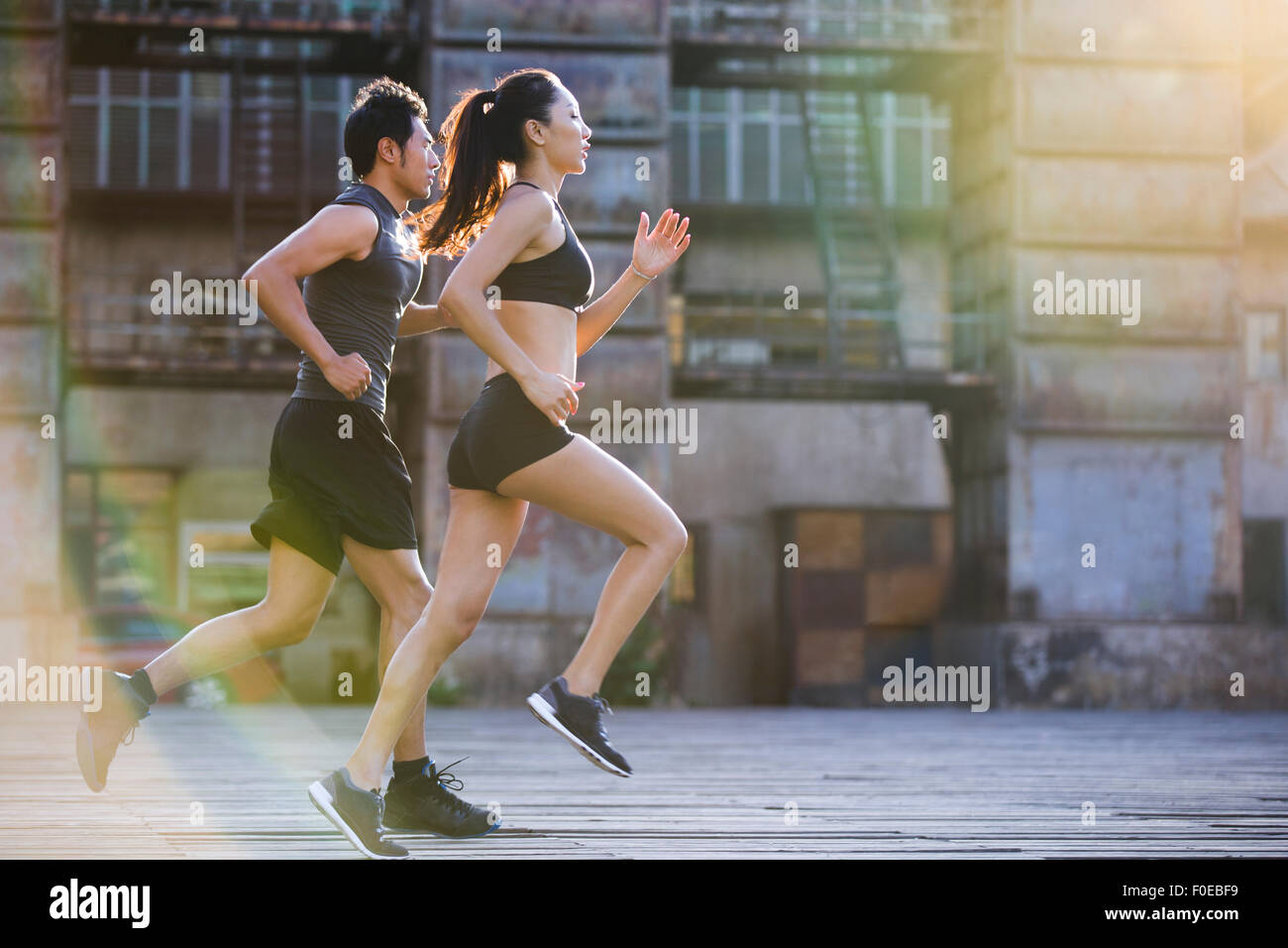 Young joggers running outdoors Stock Photo - Alamy