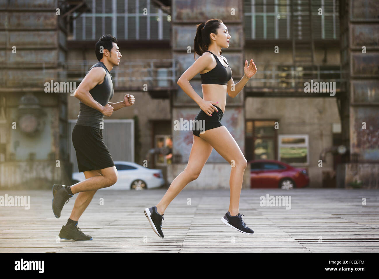 Young joggers running outdoors Stock Photo - Alamy