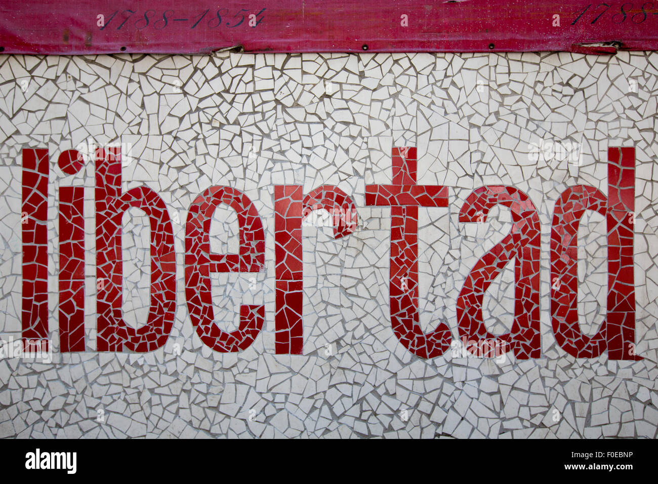The word Liberty created with mosaic tiles on a wall in downtown ...