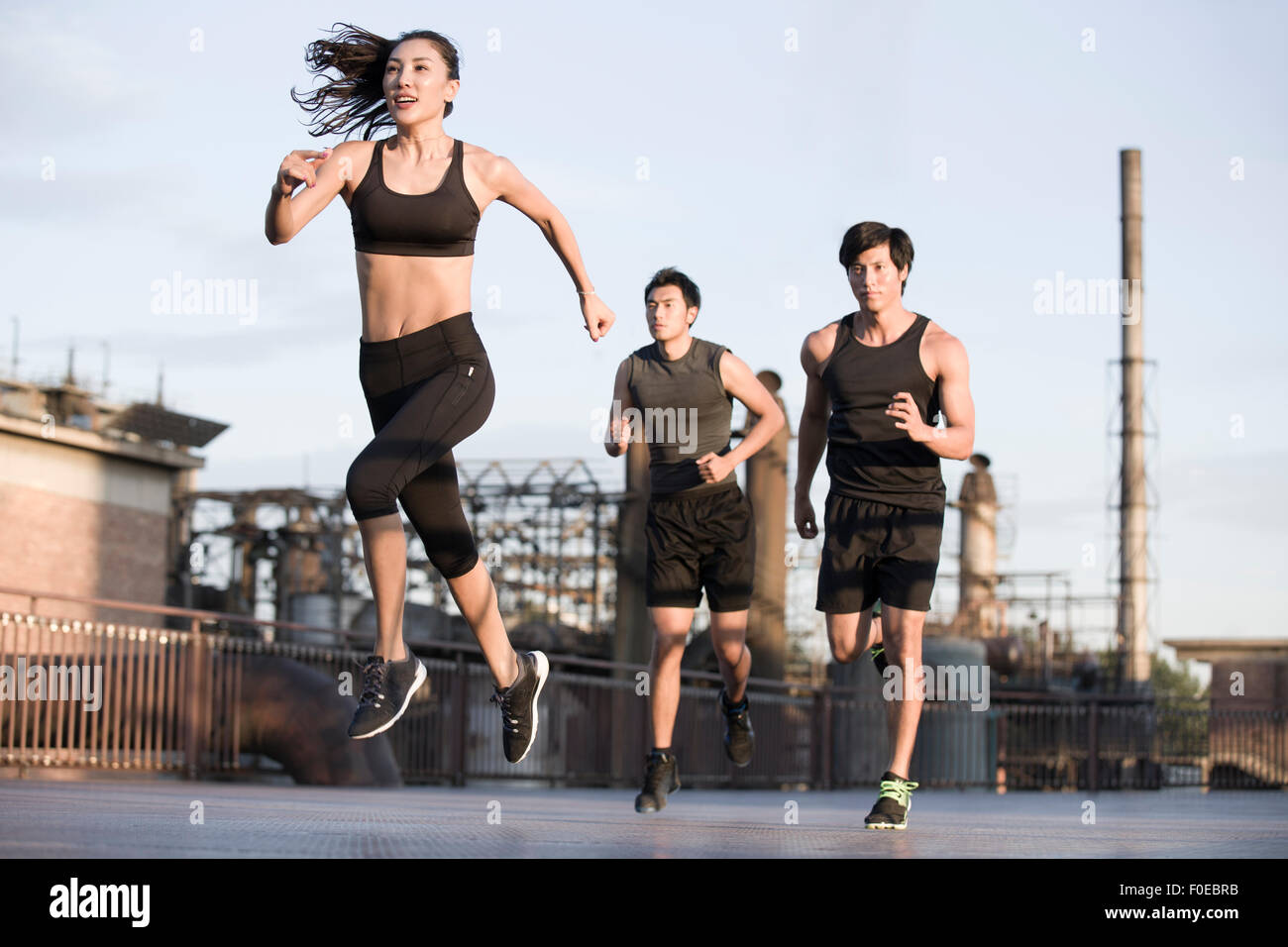 Young joggers running outdoors Stock Photo - Alamy