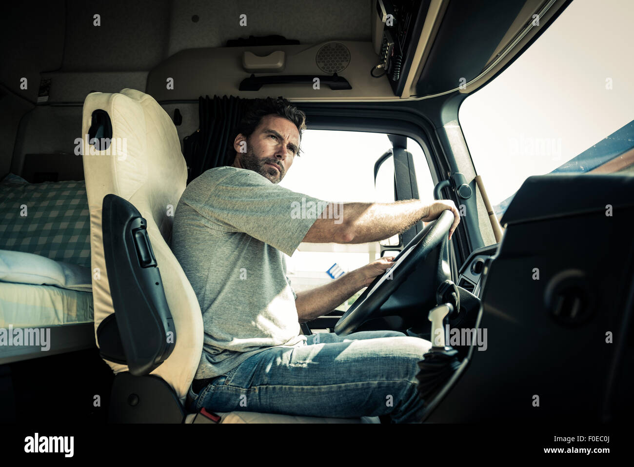 Truck driver with tractor trailer truck Stock Photo - Alamy