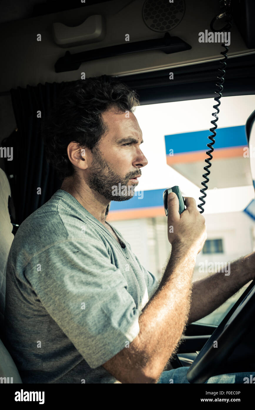 Truck driver with tractor trailer truck Stock Photo - Alamy