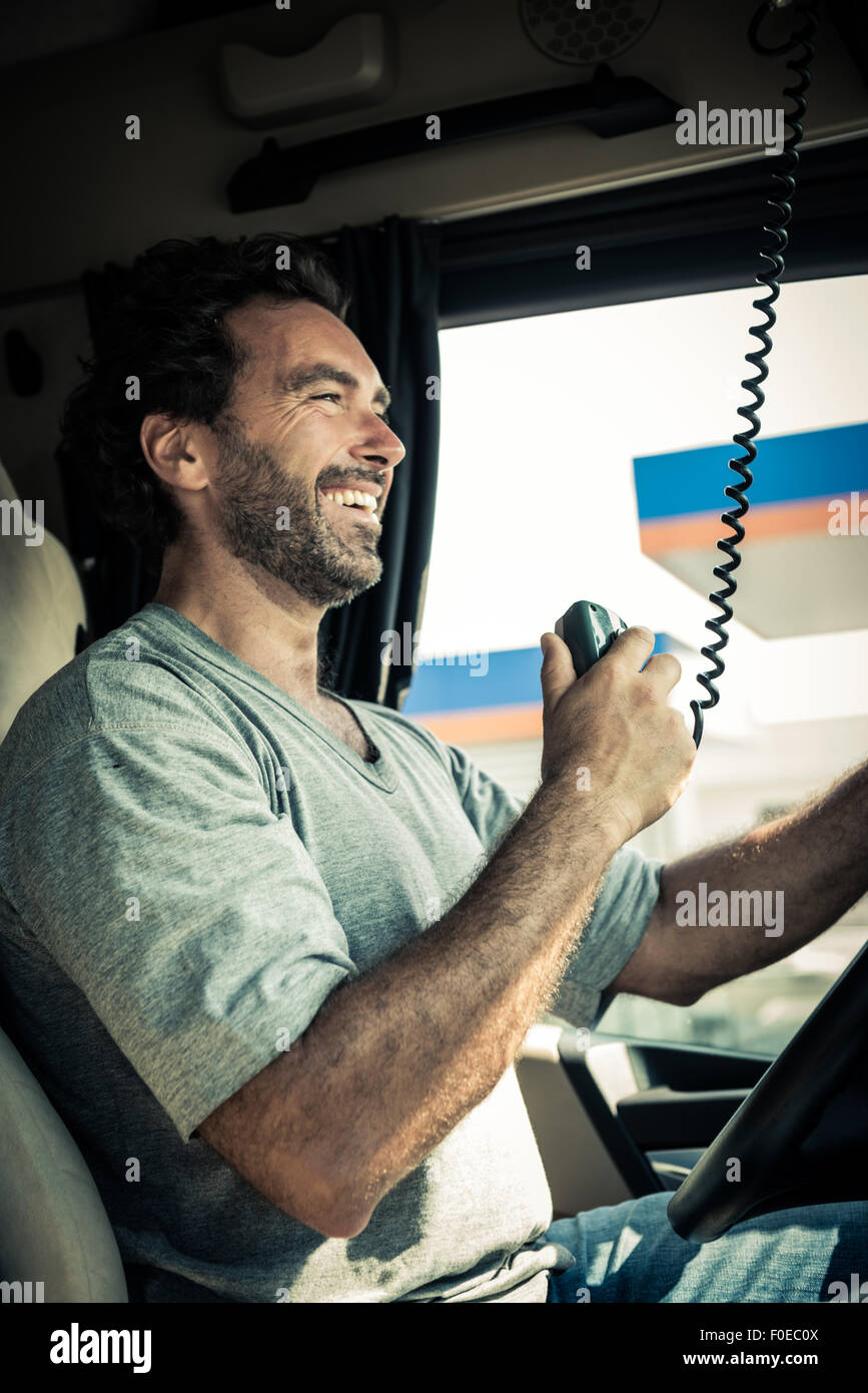 Truck driver with tractor trailer truck Stock Photo - Alamy