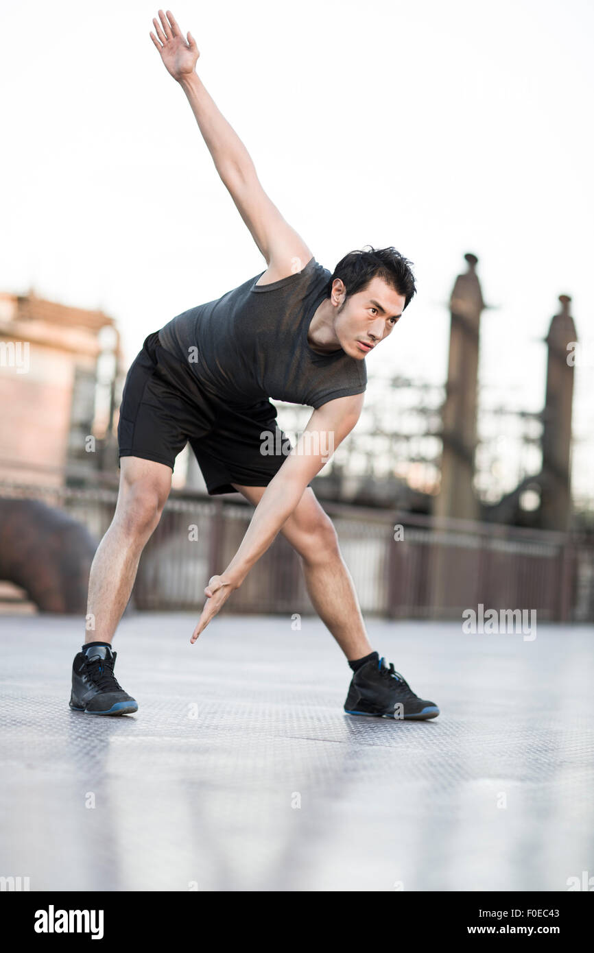 Young man exercising outdoors Stock Photo - Alamy