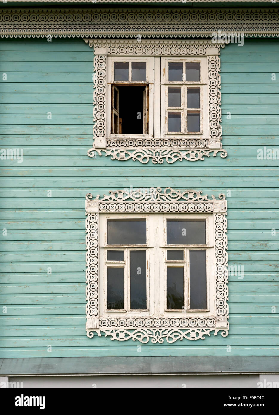 windows with carved wooden trim on the house of the 19th century Stock ...
