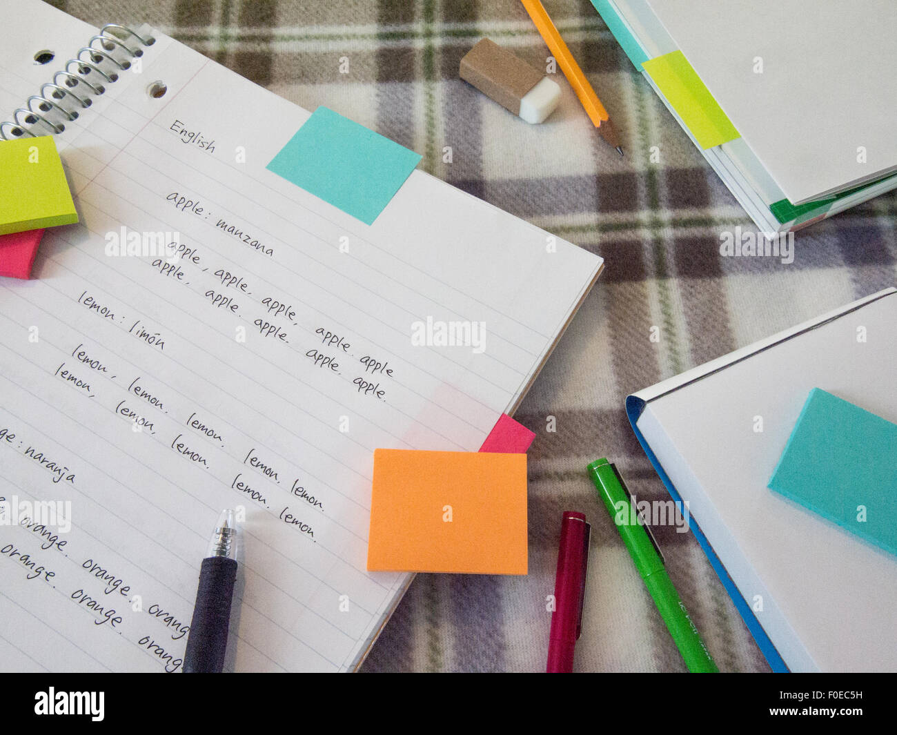 Learning other language writing words on the notebook Stock Photo - Alamy