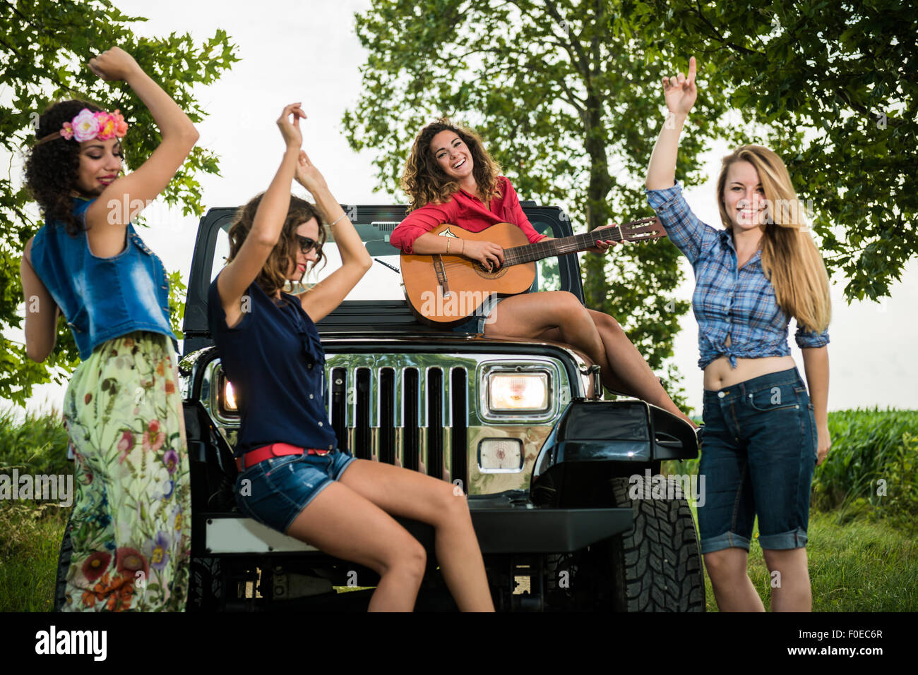 Close-up of excited girls having fun on a jeep Stock Photo - Alamy