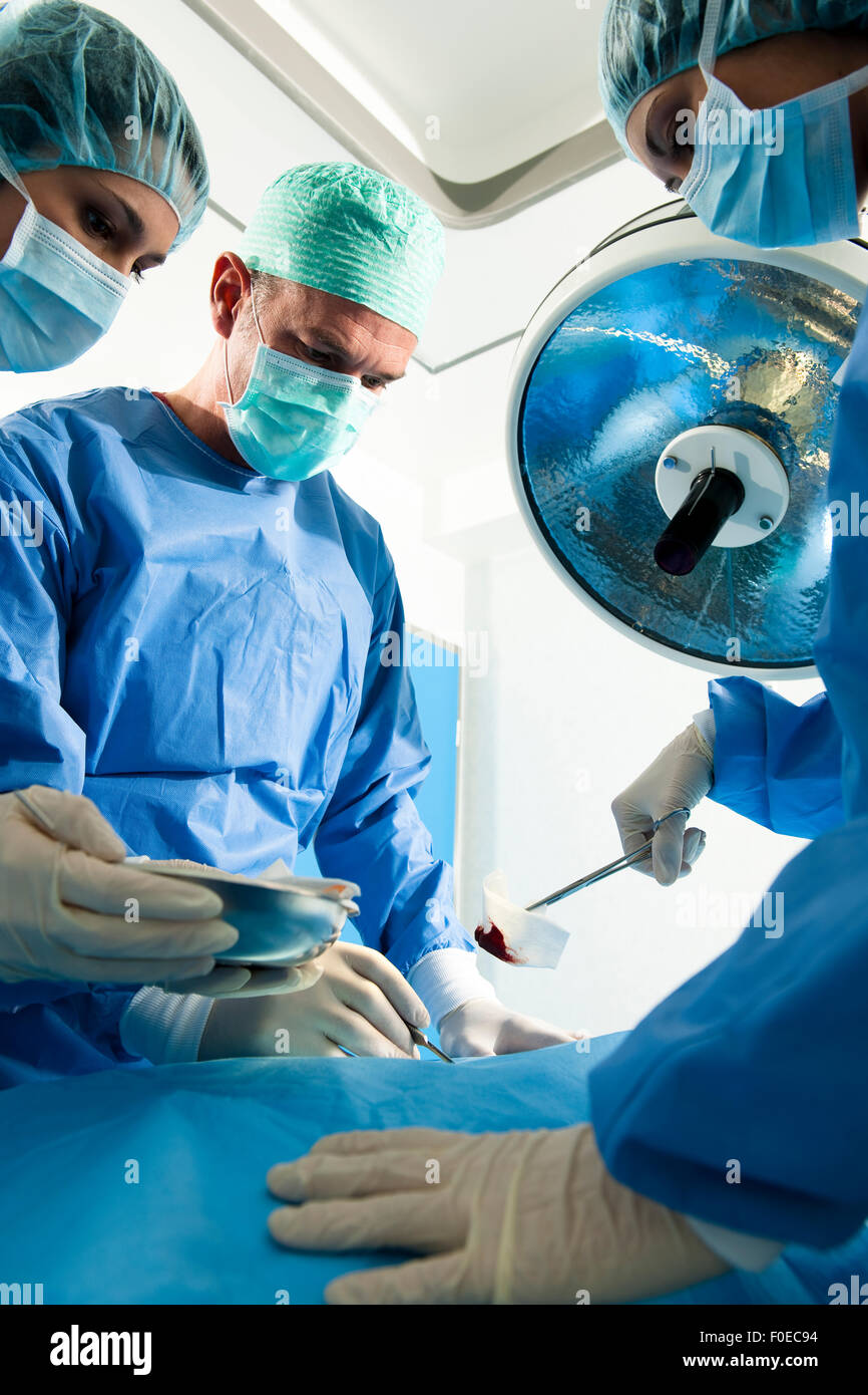 Portrait of team of surgeons at work Stock Photo - Alamy