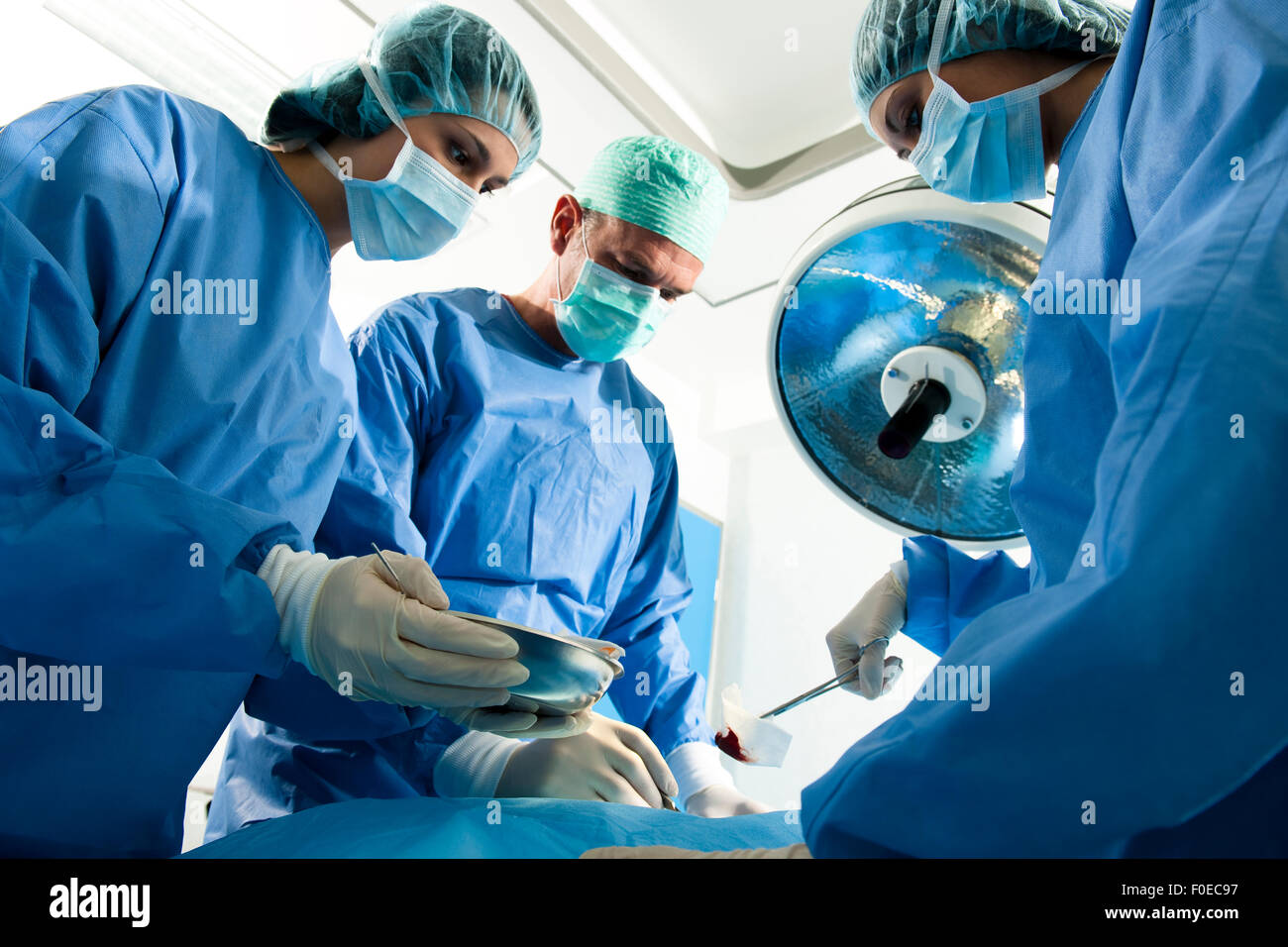 Portrait of team of surgeons at work Stock Photo - Alamy
