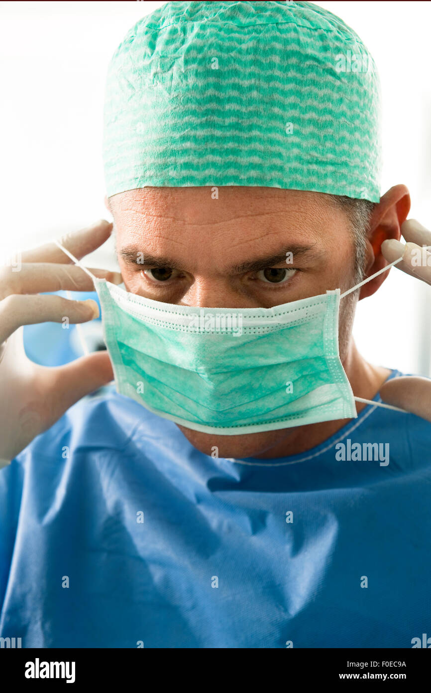 Surgeon Wearing Protective Mask, ready for operation Stock Photo - Alamy