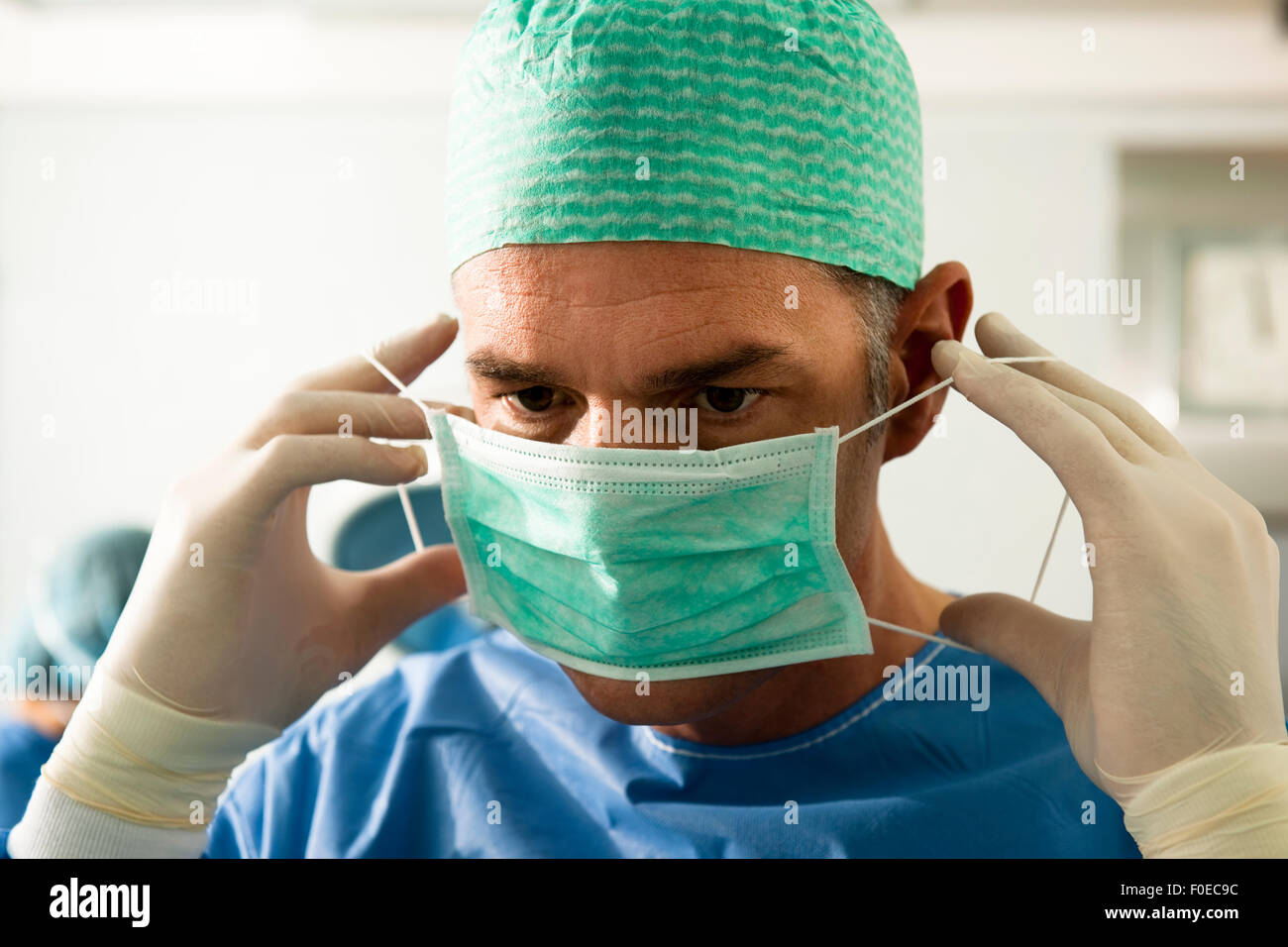 Surgeon Wearing Protective Mask, ready for operation Stock Photo - Alamy