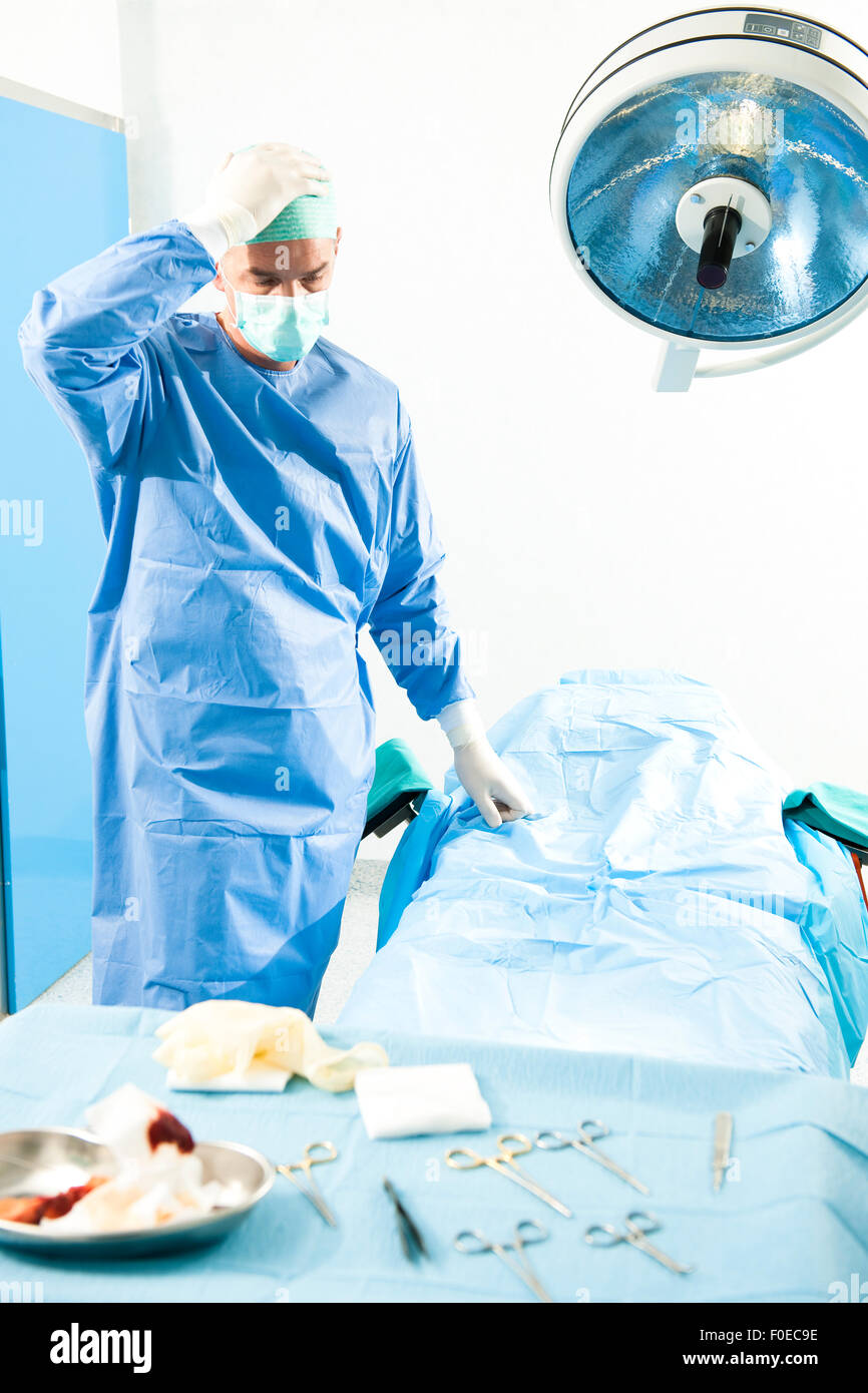 Worried Surgeon inside operating room Stock Photo - Alamy