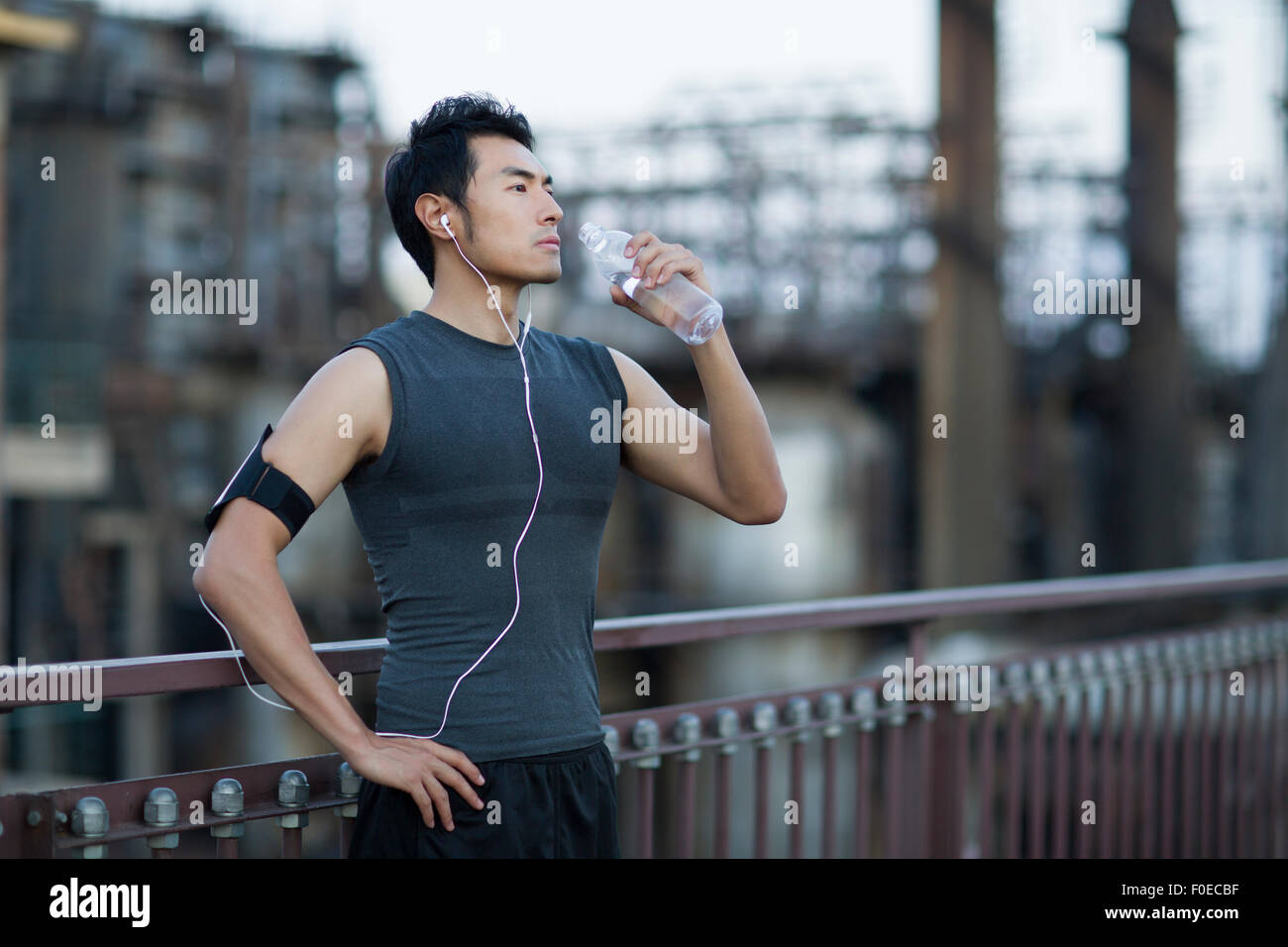 Young man having a rest after exercising outdoors Stock Photo - Alamy