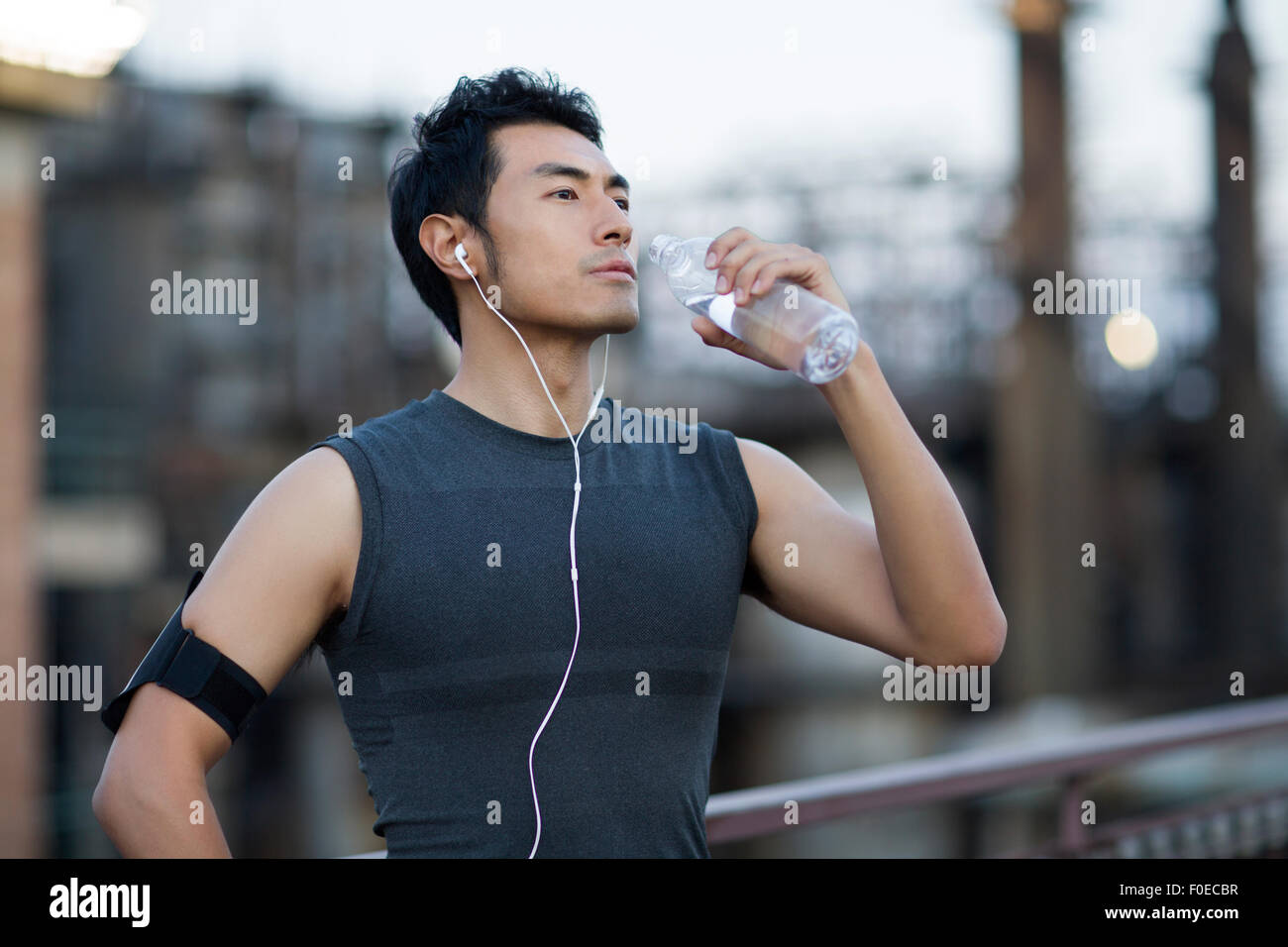 Young man having a rest after exercising outdoors Stock Photo - Alamy