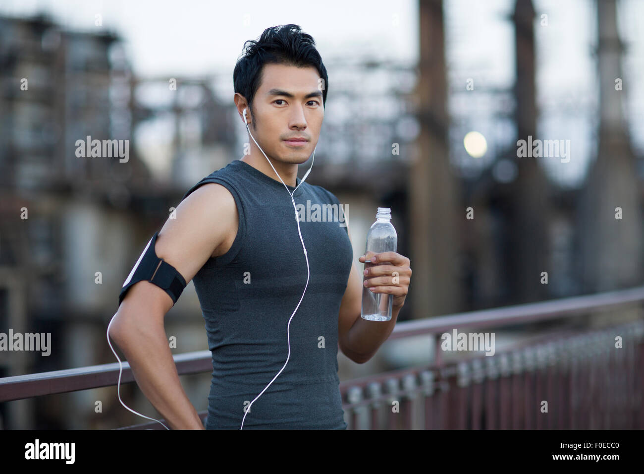 Young man having a rest after exercising outdoors Stock Photo - Alamy