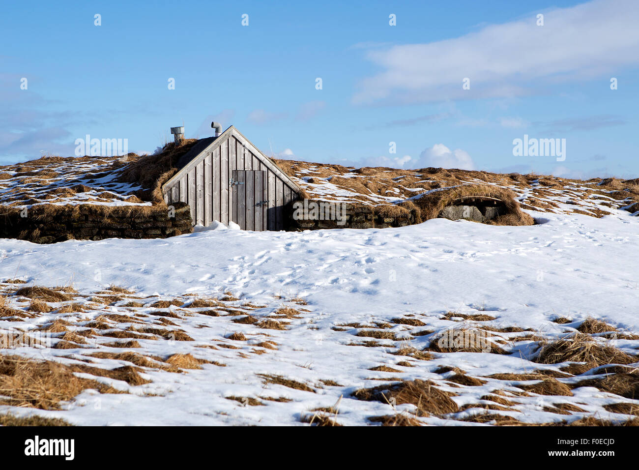Tiny hut with blue sky in snowy Iceland Stock Photo - Alamy