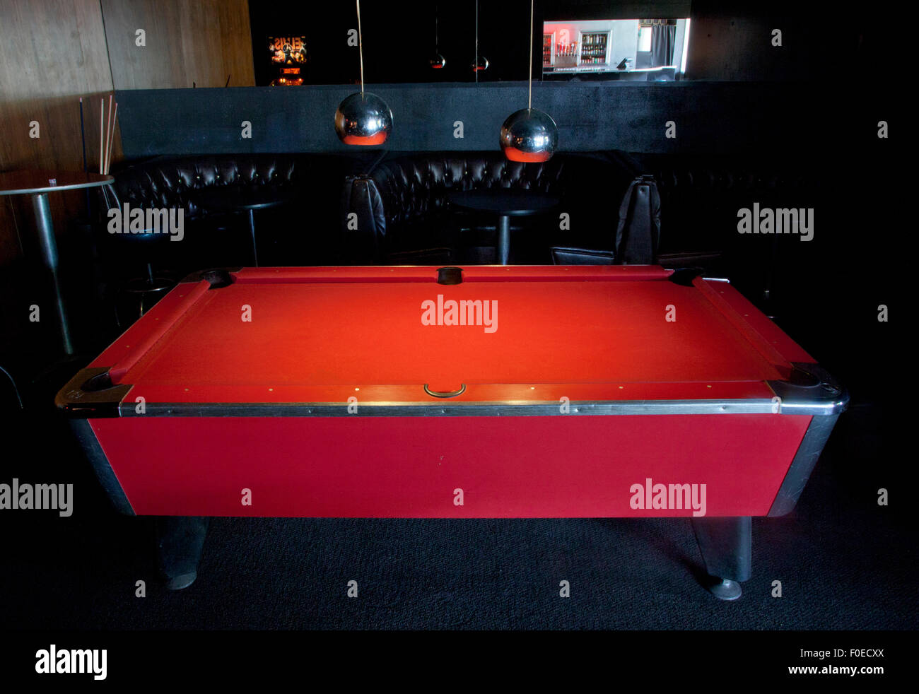Red pool billiards table in dark rock club, 2015 Stock Photo - Alamy