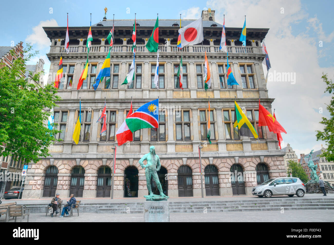 Antwerp City Hall building with flags for many nations of the world ...