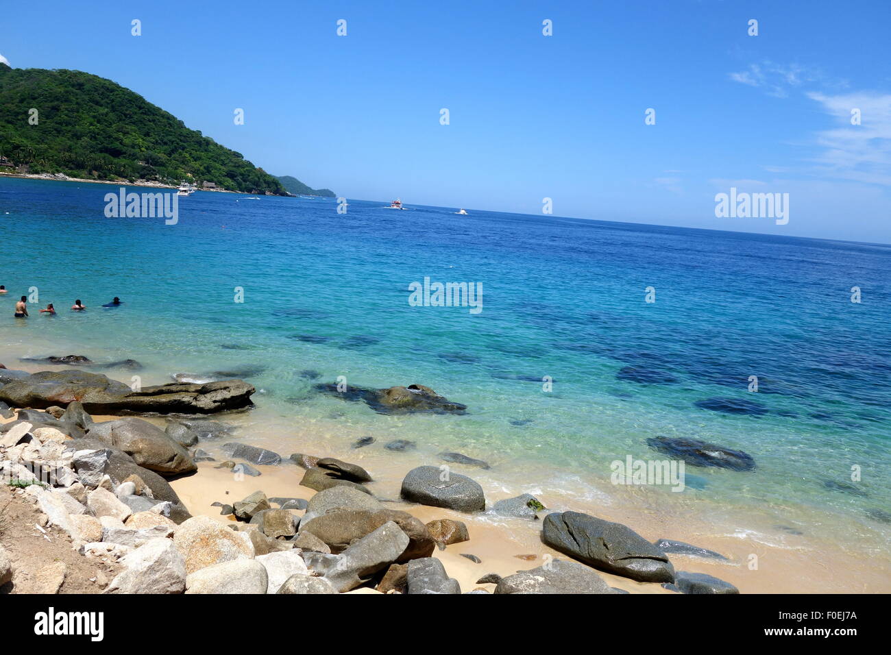 Secluded tropical beach people swimming hi-res stock photography and ...