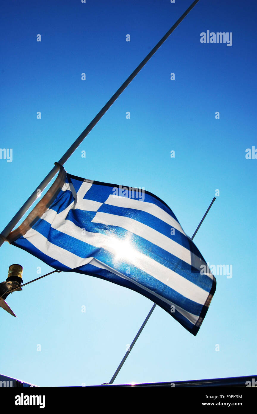 Greek flag flying against a clear blue sky Stock Photo - Alamy