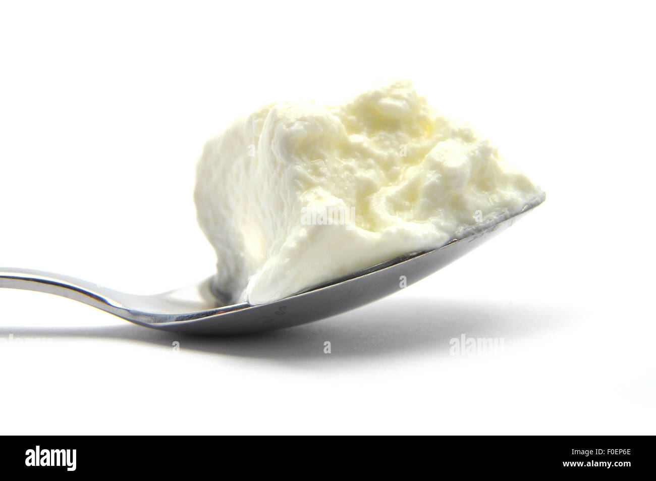 Curd on spoon Stock Photo - Alamy
