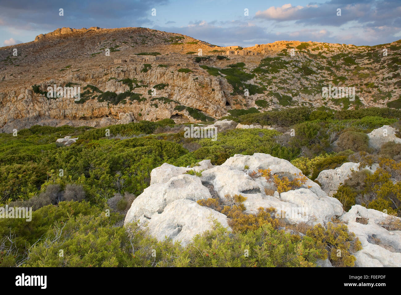 Rocky landscape with ancient ruins, evening, Antikythera island, Greece ...