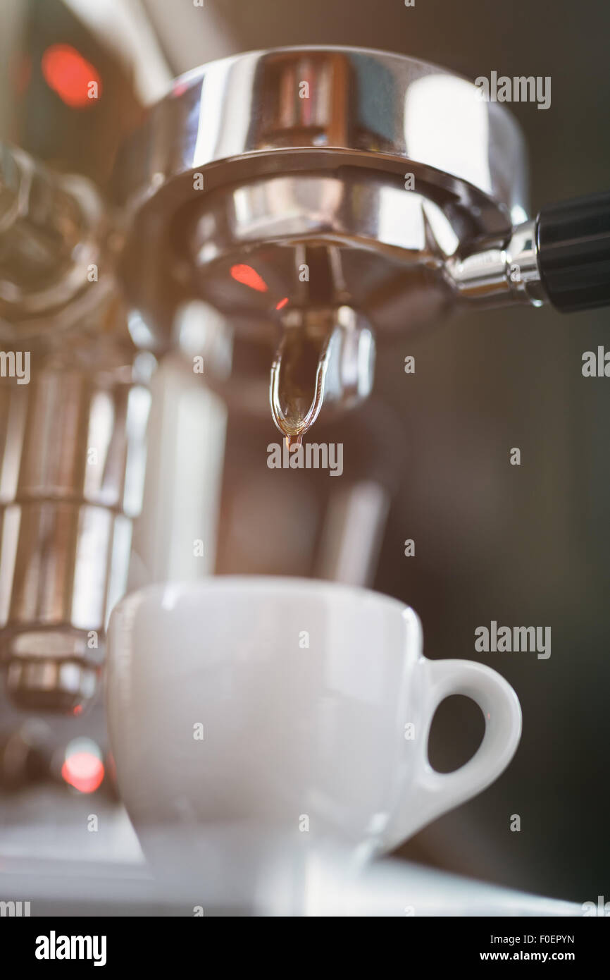 coffee extraction process from professional espresso machine, close up ...