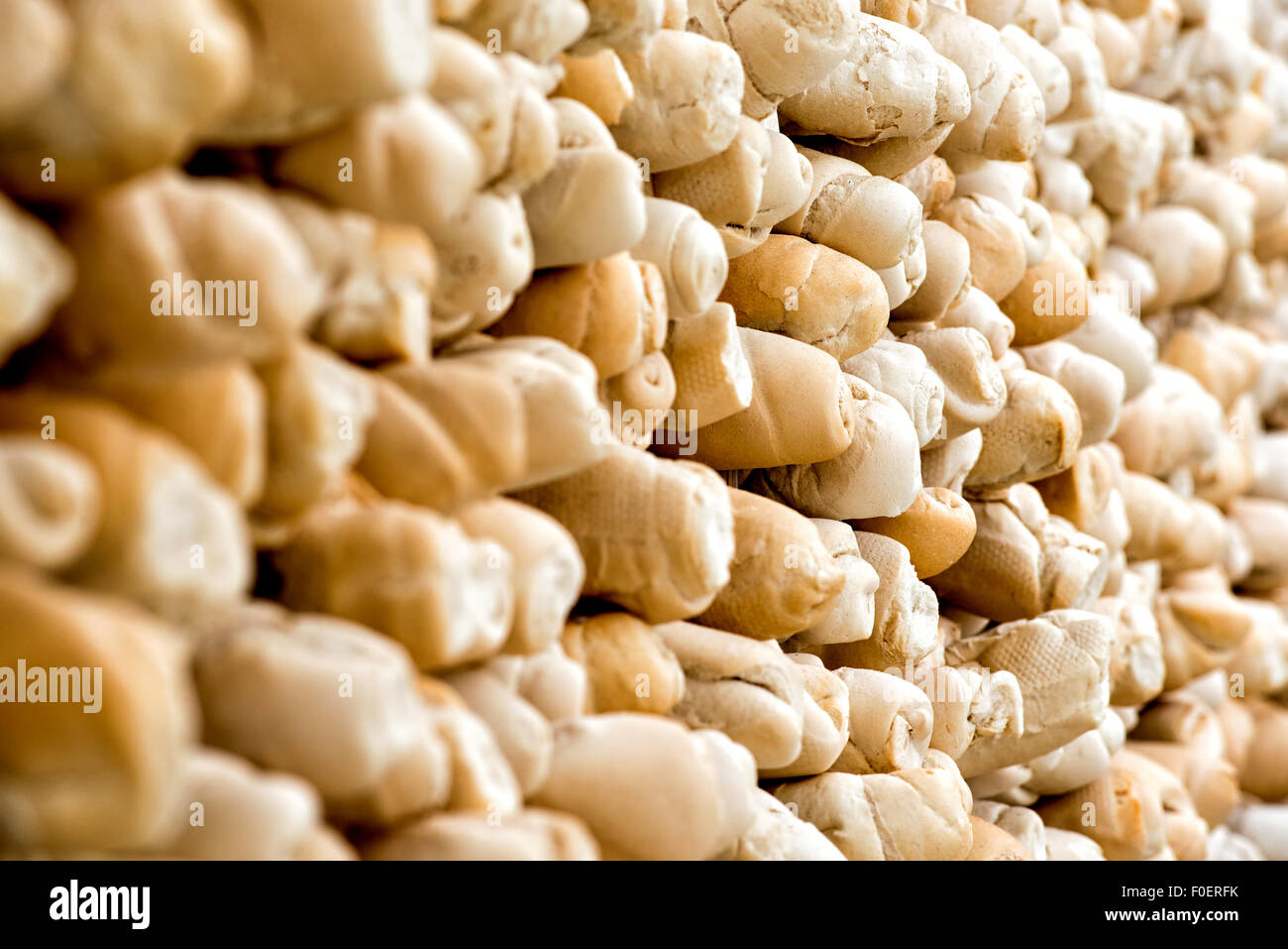 Background texture of stacked freshly baked white bread rolls Stock ...
