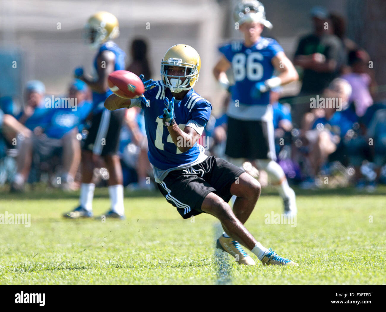 San Bernardino, CA. 10th Aug, 2015. UCLA receiver (14) Mossi Johnson ...