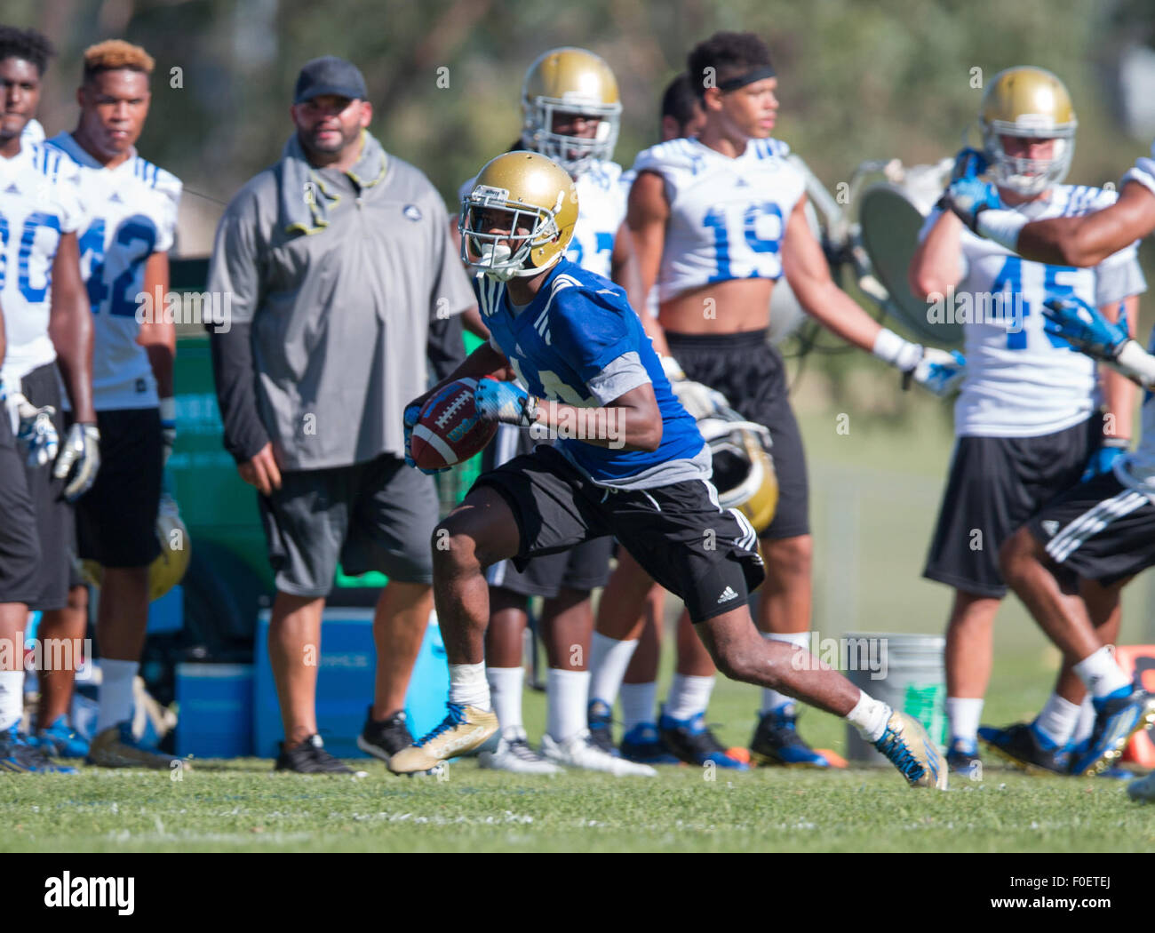 San Bernardino, CA. 10th Aug, 2015. UCLA receiver (14) Mossi Johnson in ...