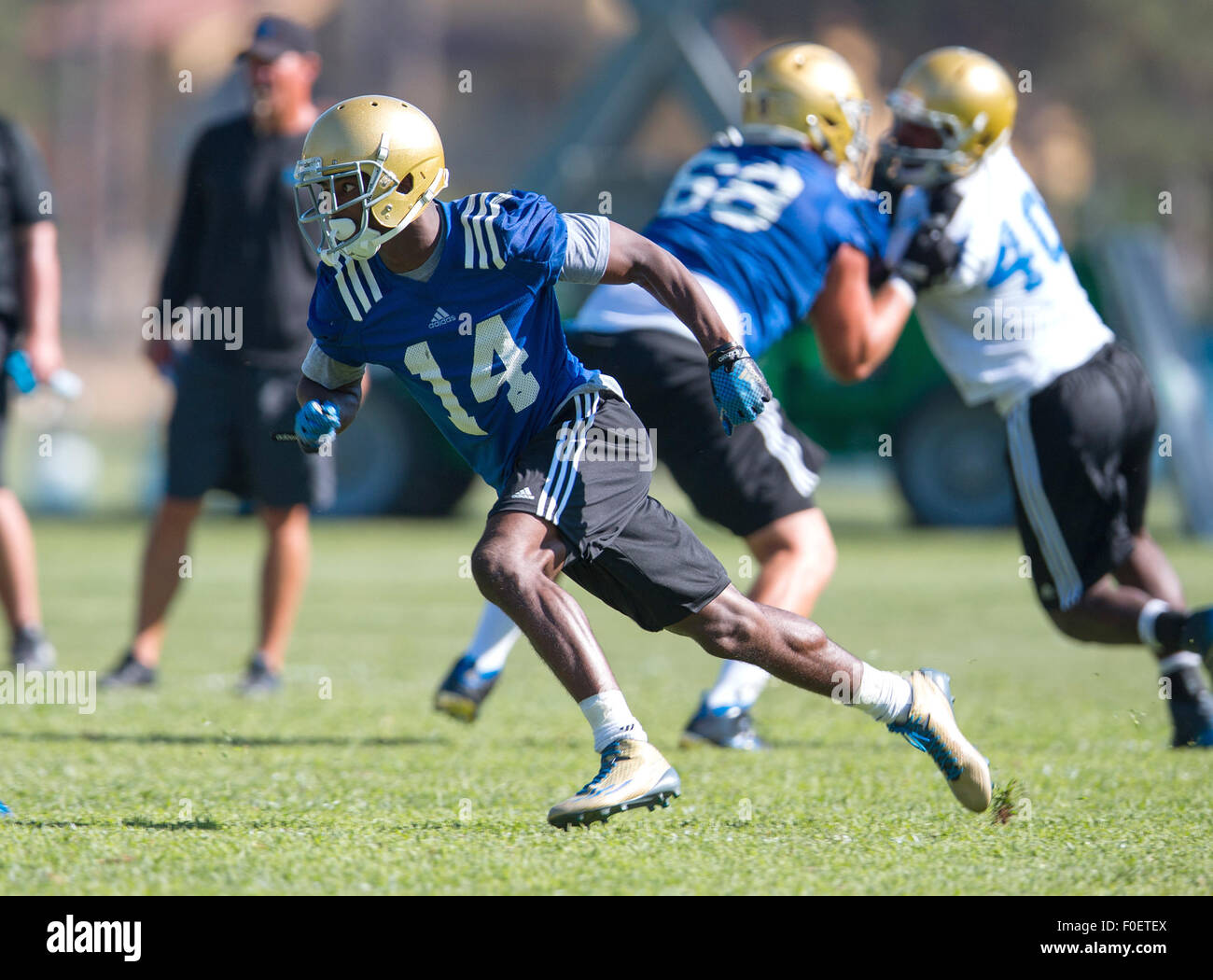 San Bernardino, CA. 10th Aug, 2015. UCLA receiver (14) Mossi Johnson in ...