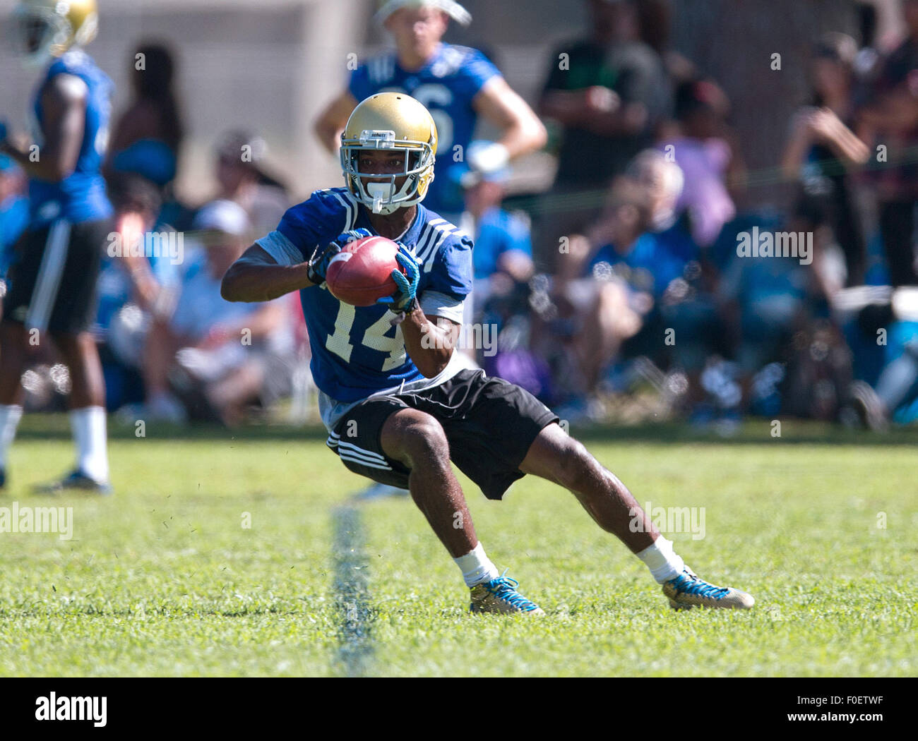 San Bernardino, CA. 10th Aug, 2015. UCLA receiver (14) Mossi Johnson ...