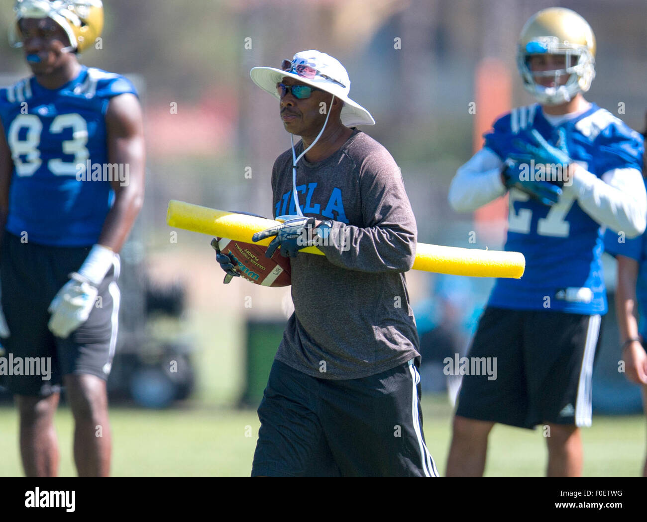 San Bernardino, CA. 10th Aug, 2015. UCLA coach Eric Yarber gets set to ...