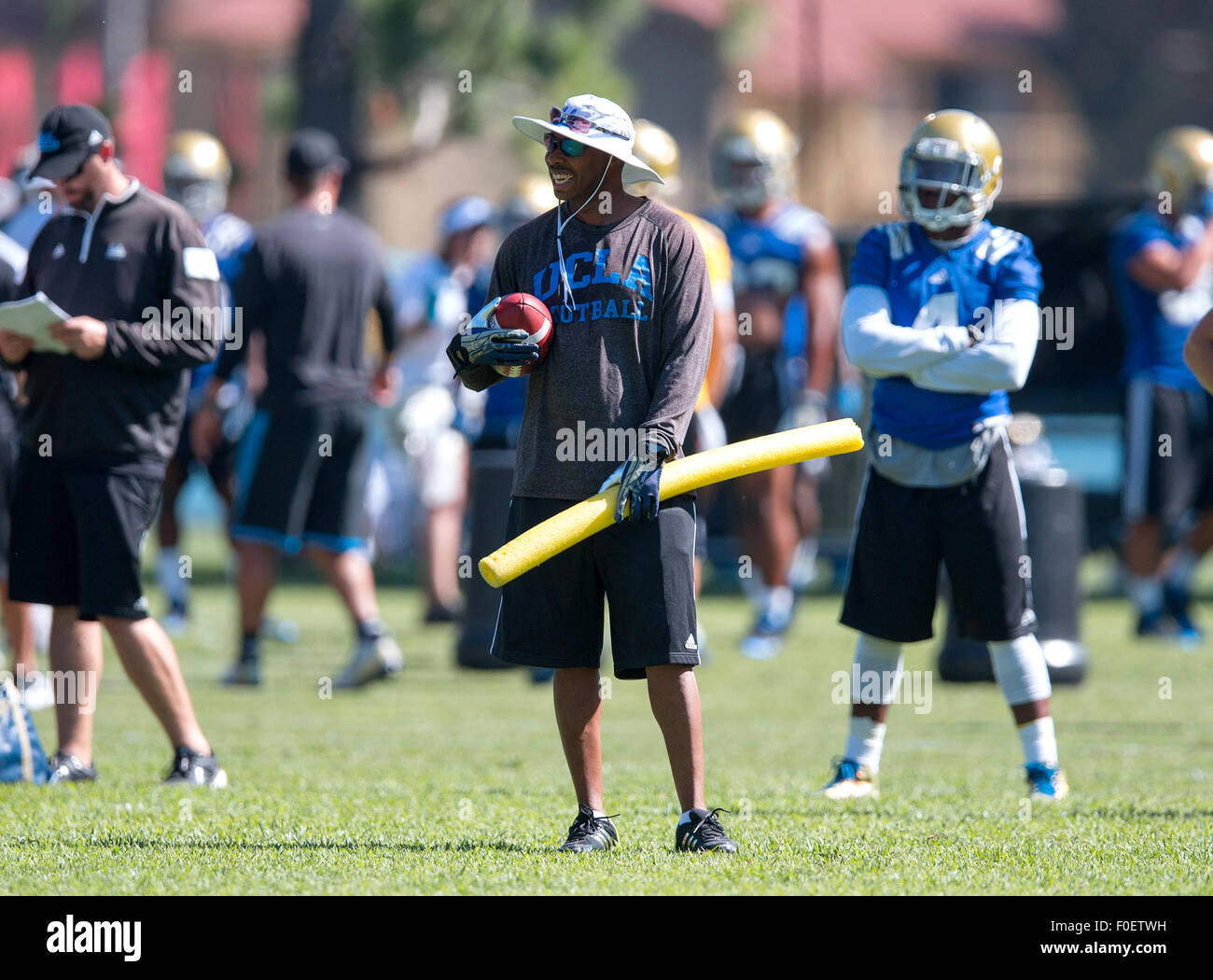 San Bernardino, CA. 10th Aug, 2015. UCLA coach Eric Yarber gets set to ...