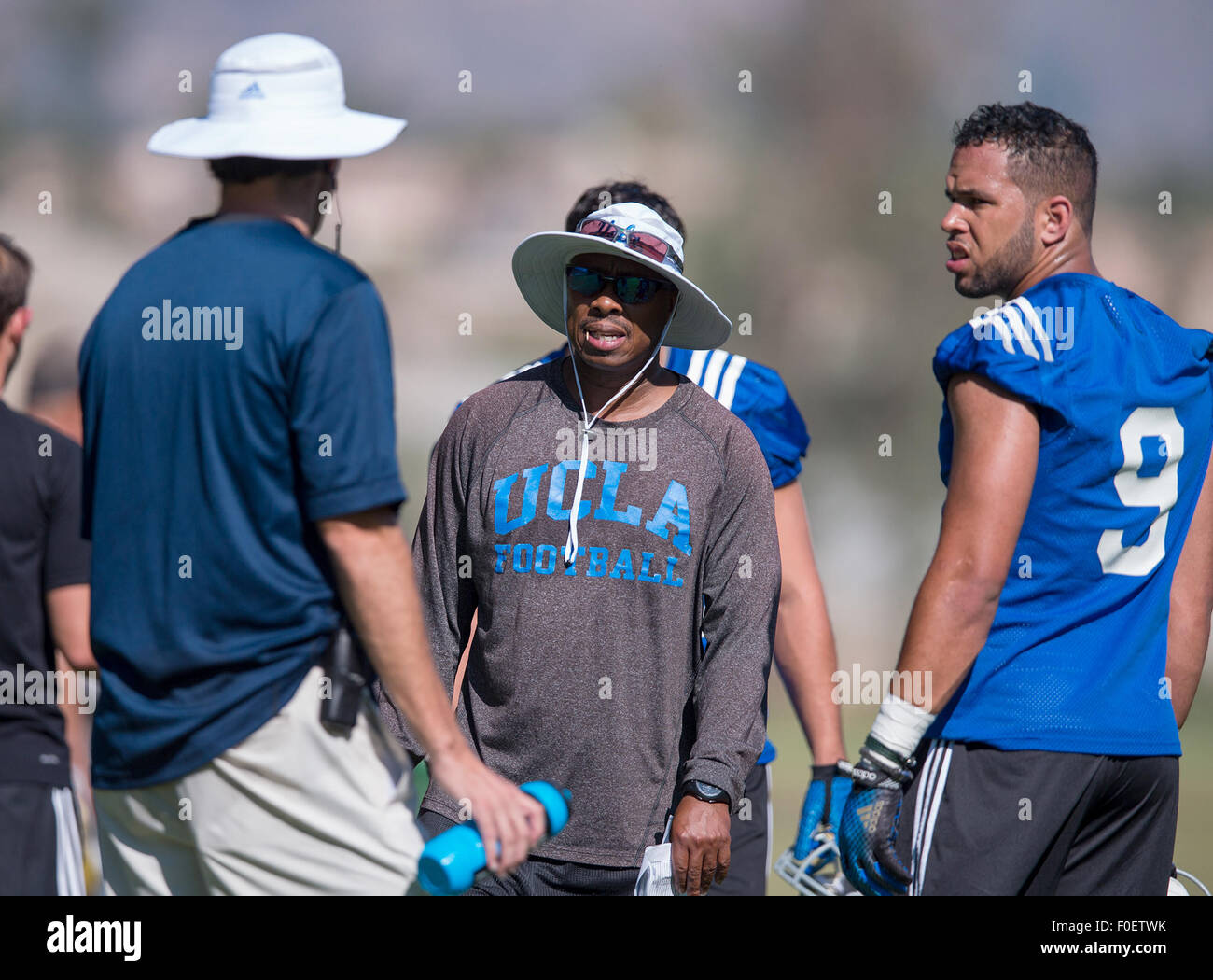 San Bernardino, CA. 10th Aug, 2015. UCLA coach Eric Yarber gets set to ...