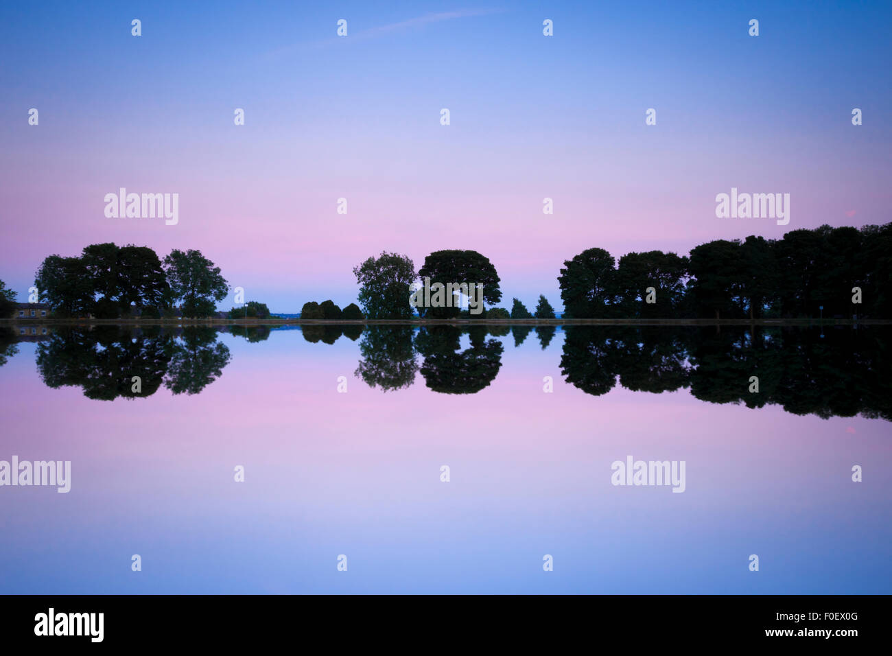reflection on a lake at sunset Stock Photo - Alamy