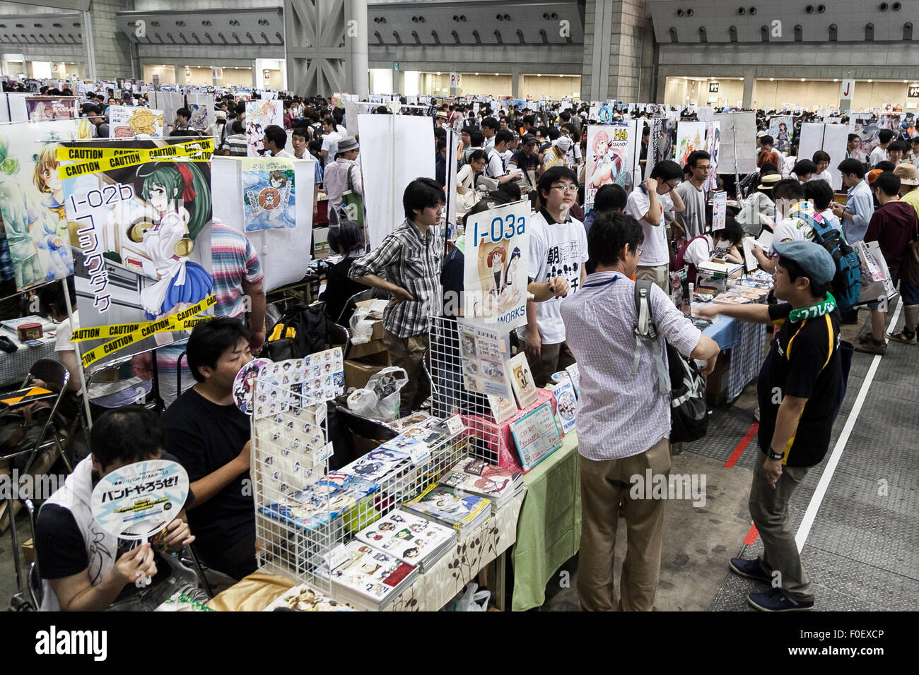 Tokyo, Japan. 14th August, 2015. Visitors look at manga books during ...