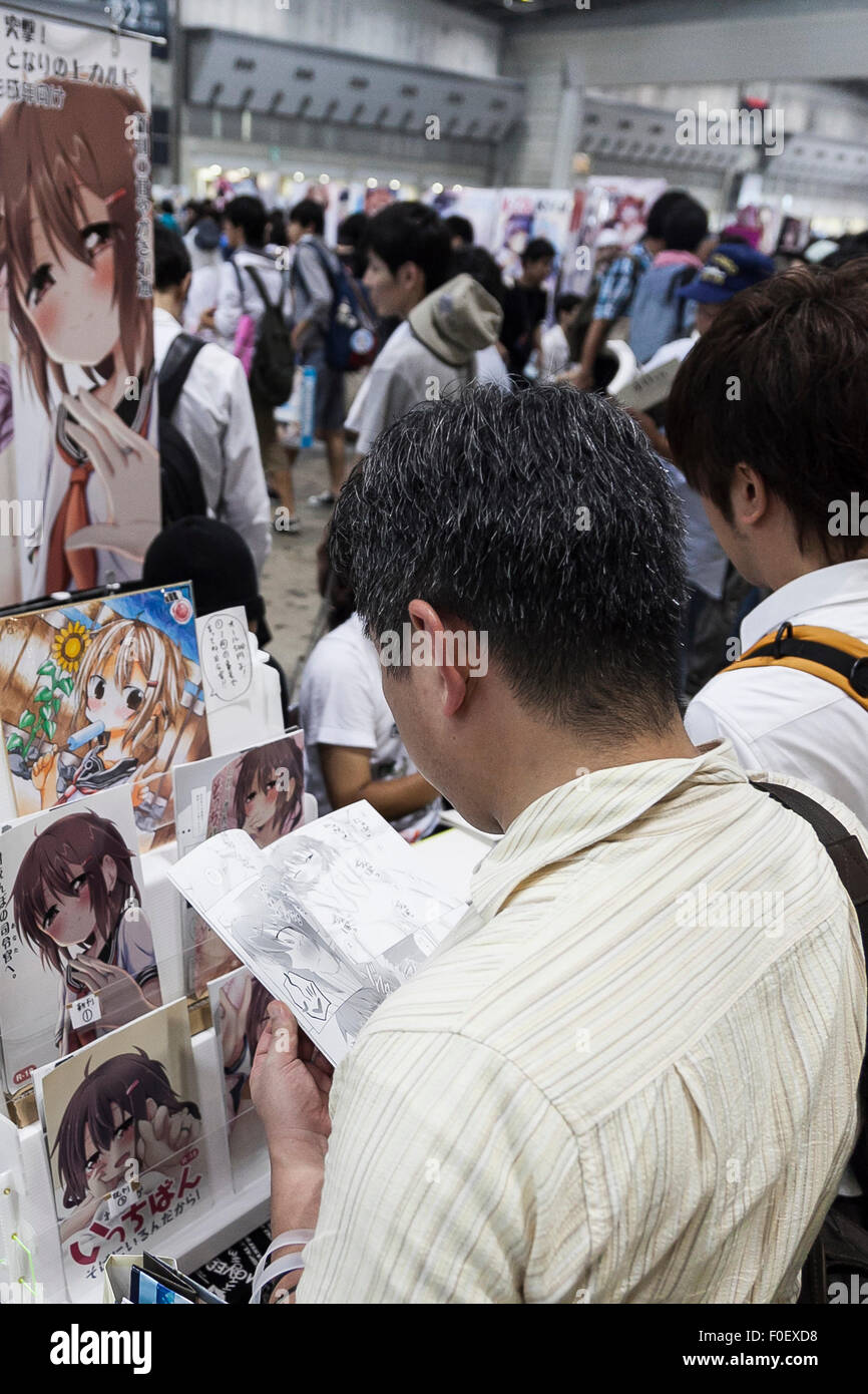 Tokyo, Japan. 14th August, 2015. A man reads a manga book during the ...