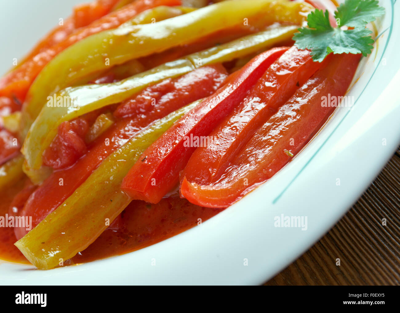 Piperade - typical Basque dish prepared with onion, green peppers, and ...