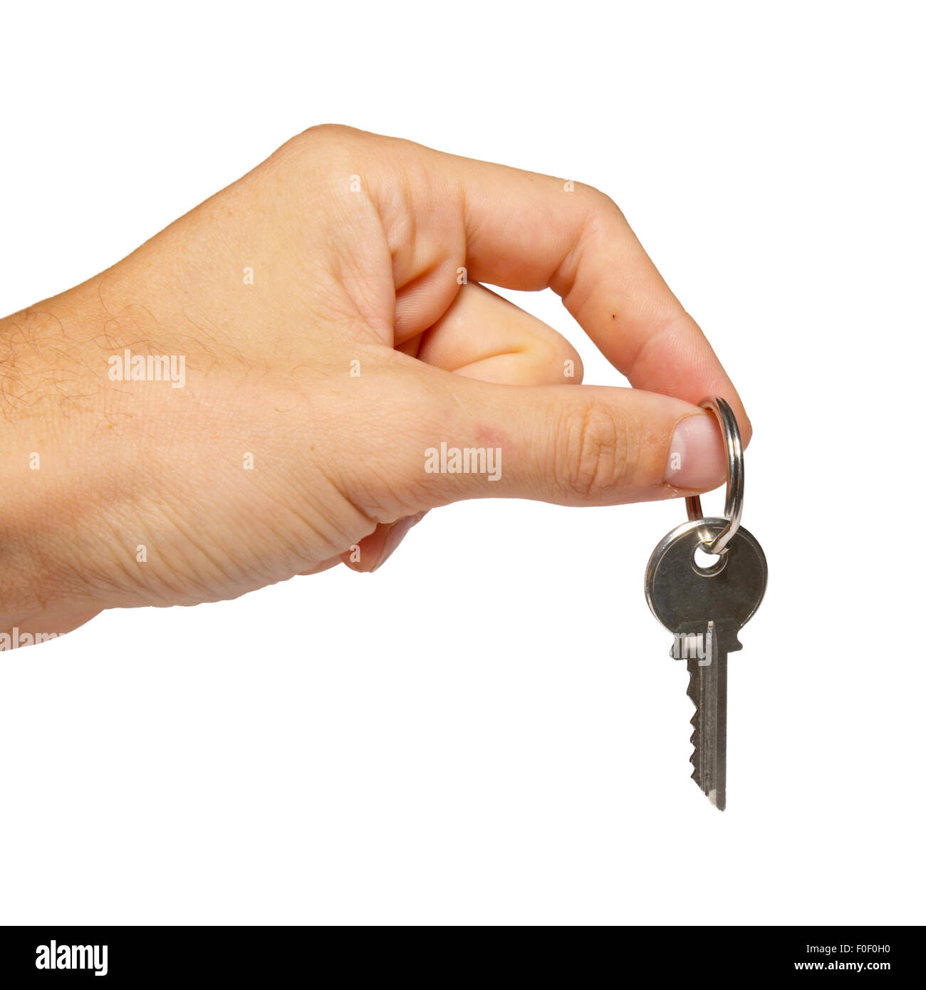 Silver key in a hand isolated on white Stock Photo - Alamy