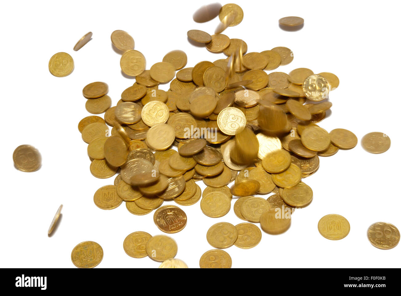 Rain of gold coins isolated on white Stock Photo - Alamy