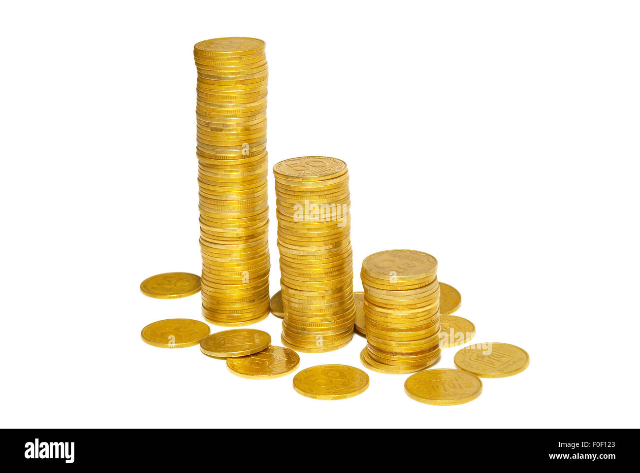 Stacks of golden coins isolated on white Stock Photo - Alamy