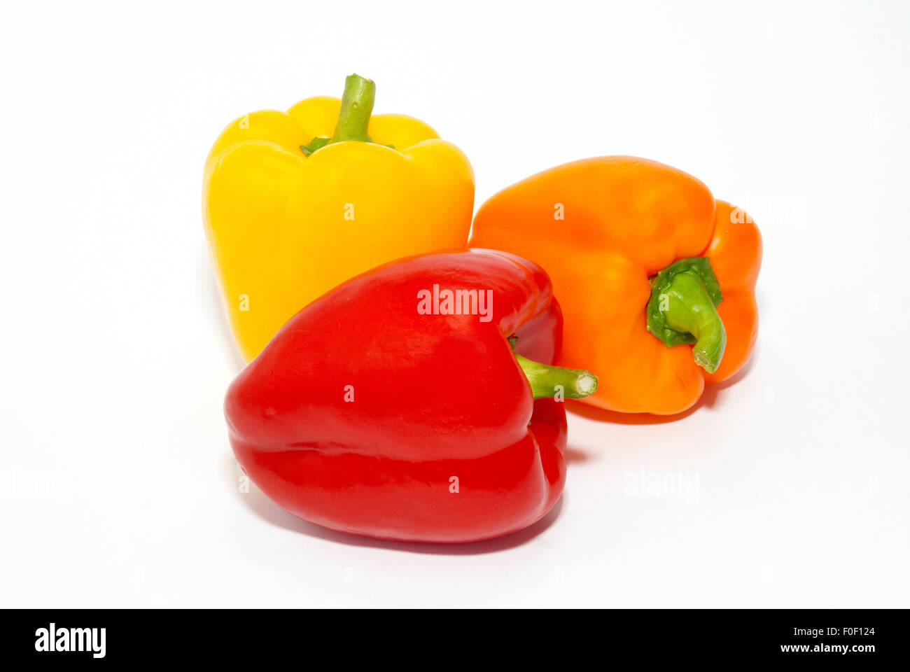 Three colored paprika isolated on white Stock Photo - Alamy