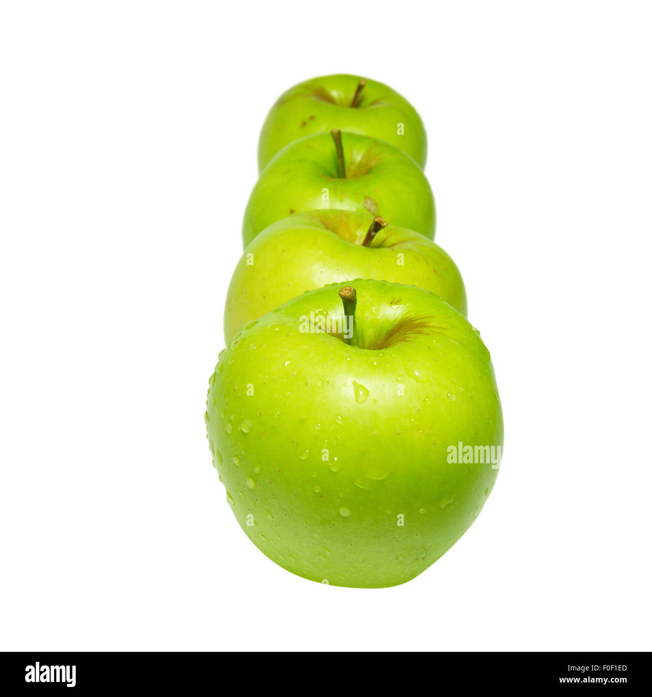 Row of green apples isolated on white Stock Photo - Alamy